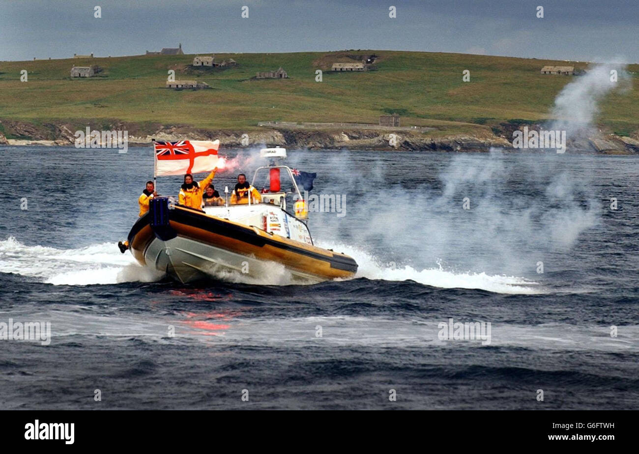 The Trans Atlantic Arctic Expedition team, led by Bear Grylls (holding ...