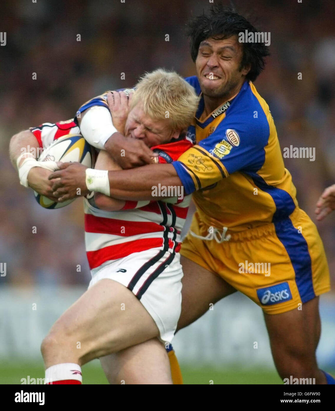 Leeds's Willie Pouching (right) tackles Wigan's Mick Cassidy during ...