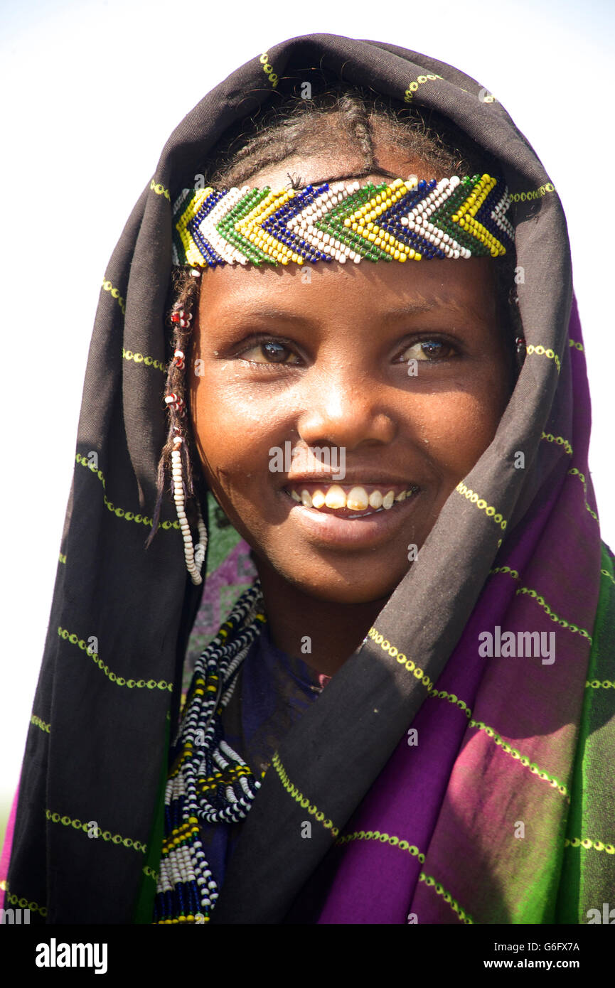 An Afar girl in tribal attire. The nomadic Afar live in the low-lying ...