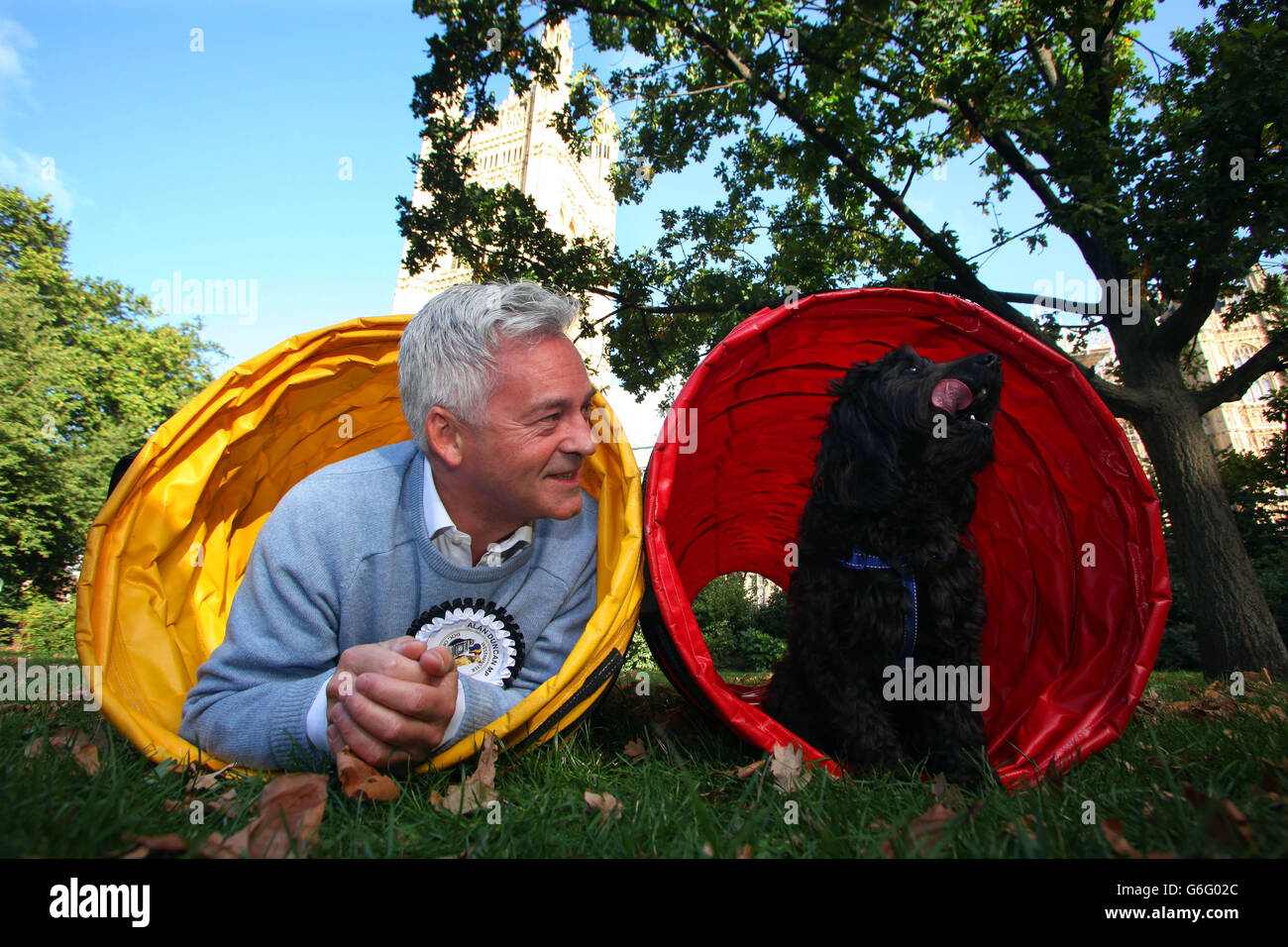 EDITORIAL USE ONLY: MP Alan Duncan with his cockapoo Noodle, who was ...