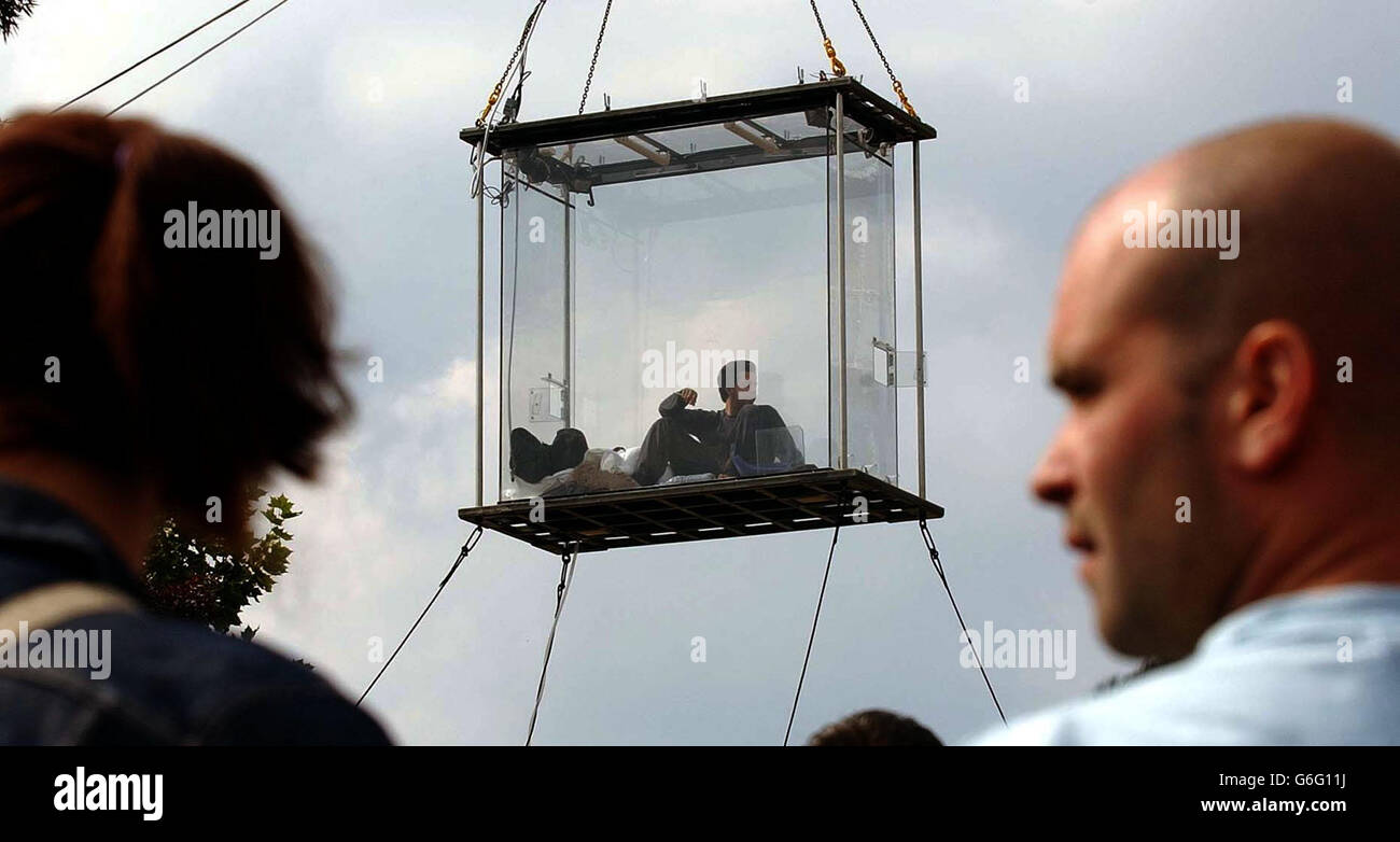 American illusionist David Blaine aged 30, in his glass box which is ...