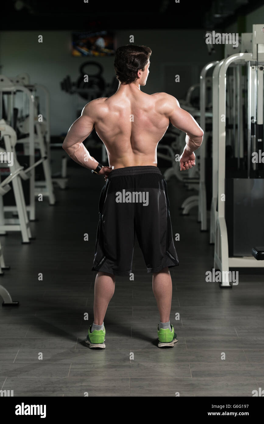 Bodybuilder Posing In Different Poses Demonstrating Their Muscles ...