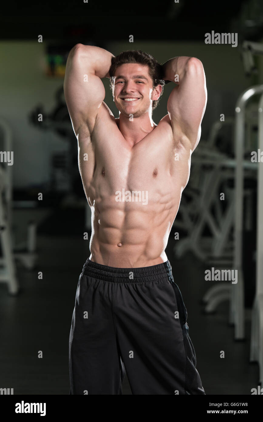 Bodybuilder Posing In Different Poses Demonstrating Their Muscles ...