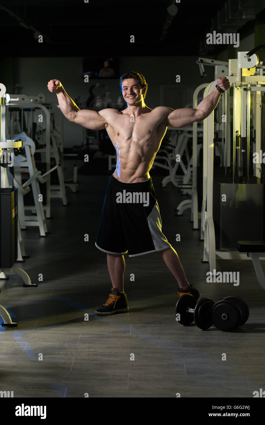 Bodybuilder Posing In Different Poses Demonstrating Their Muscles ...