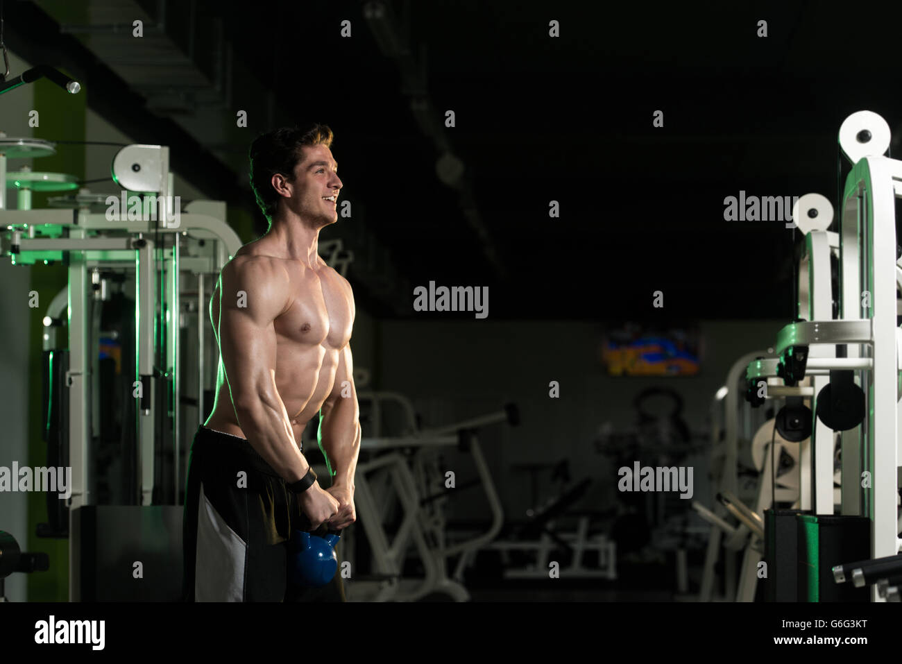 Man flexing muscles mirror hi-res stock photography and images - Alamy
