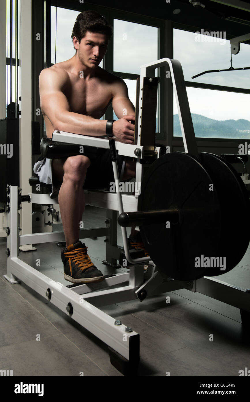 Bodybuilder Doing Heavy Weight Exercise For Legs Calves Stock Photo - Alamy