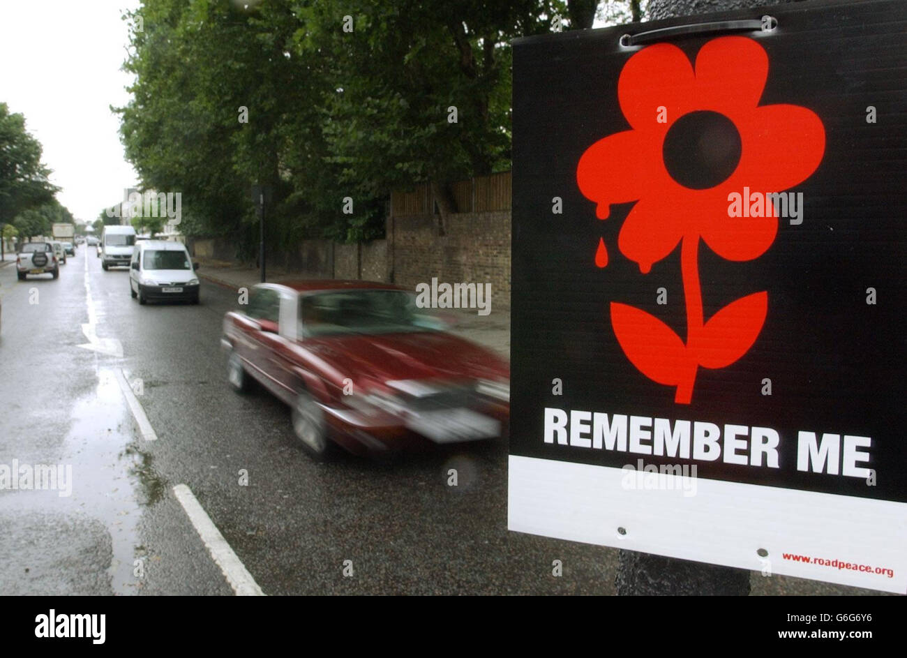 A 'Remember Me' sign attached to a lampost on London's Holland Road ...