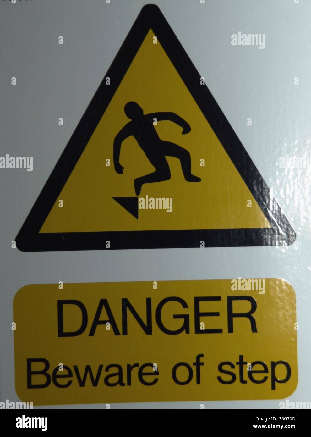 Health and safety sign. Danger beware of step sign Stock Photo - Alamy