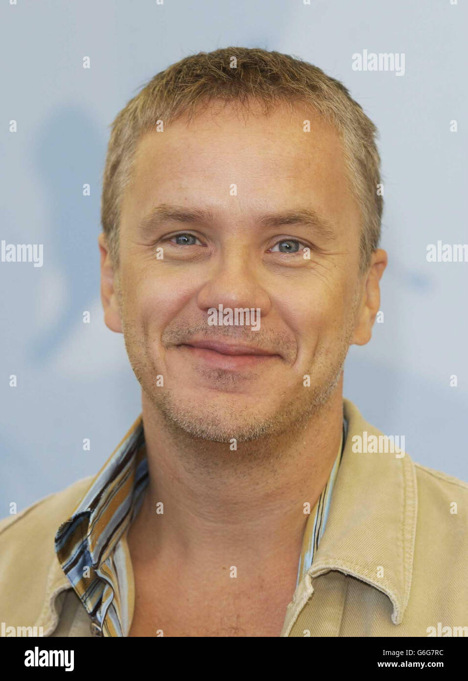 Actor Tim Robbins poses for photographers to promote his new film 'Code ...