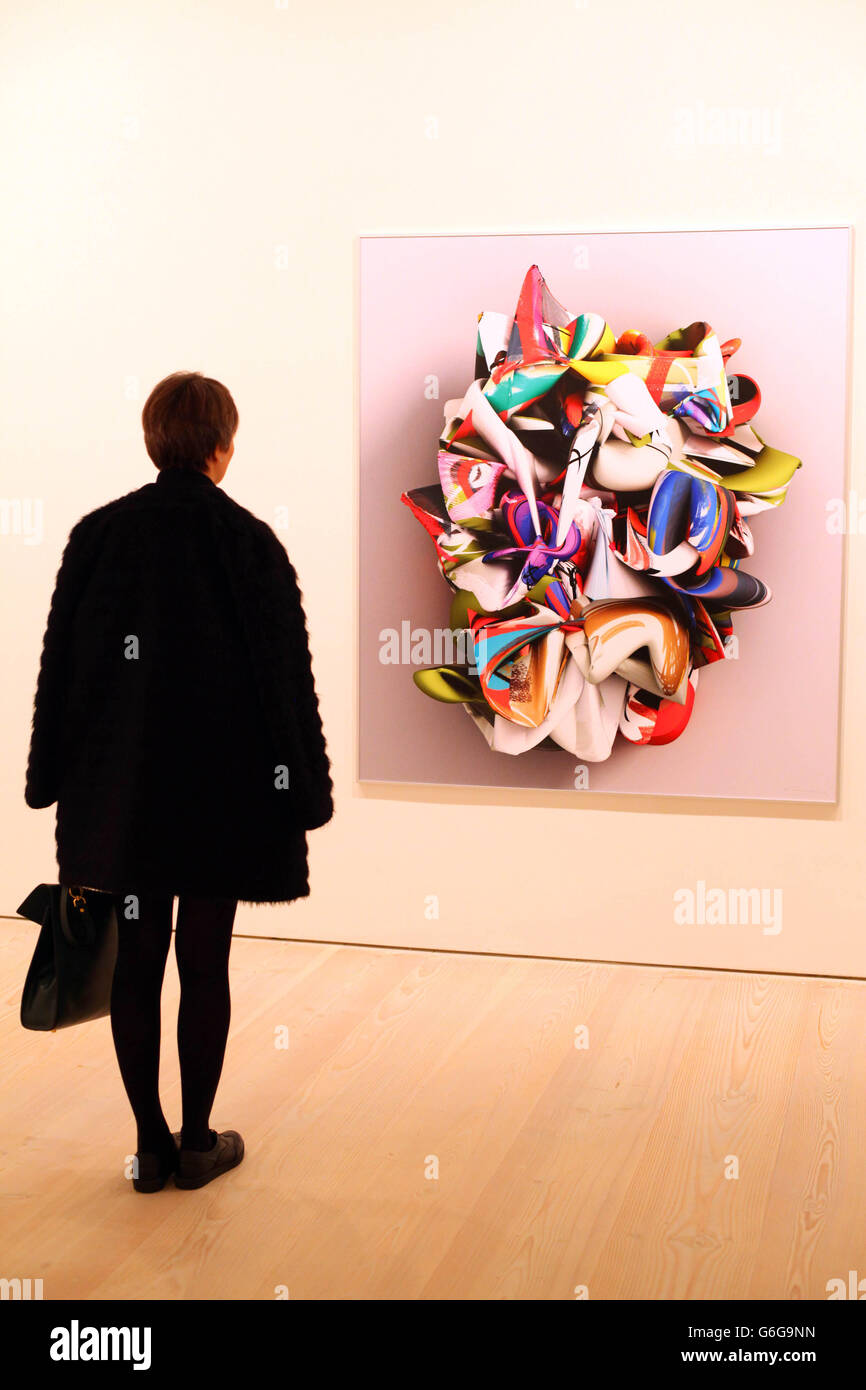 EDITORIAL USE ONLY A woman looks at Chameleon by Stepan Ryabchenko at ...