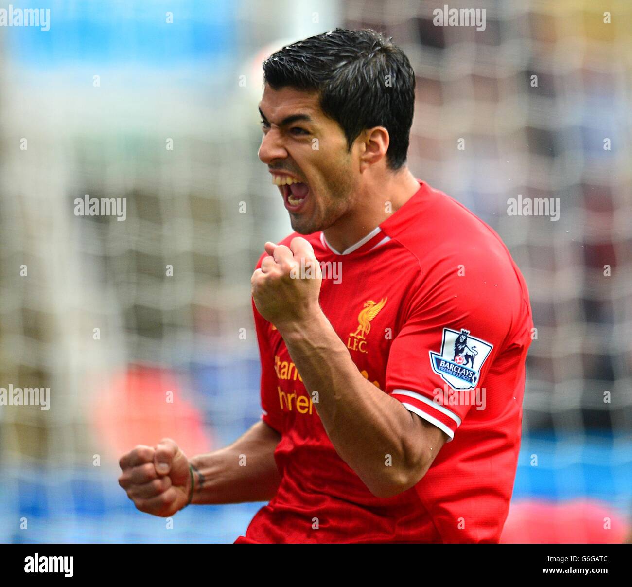 Liverpool's Luis Suarez celebrates assisting his side's second goal of ...