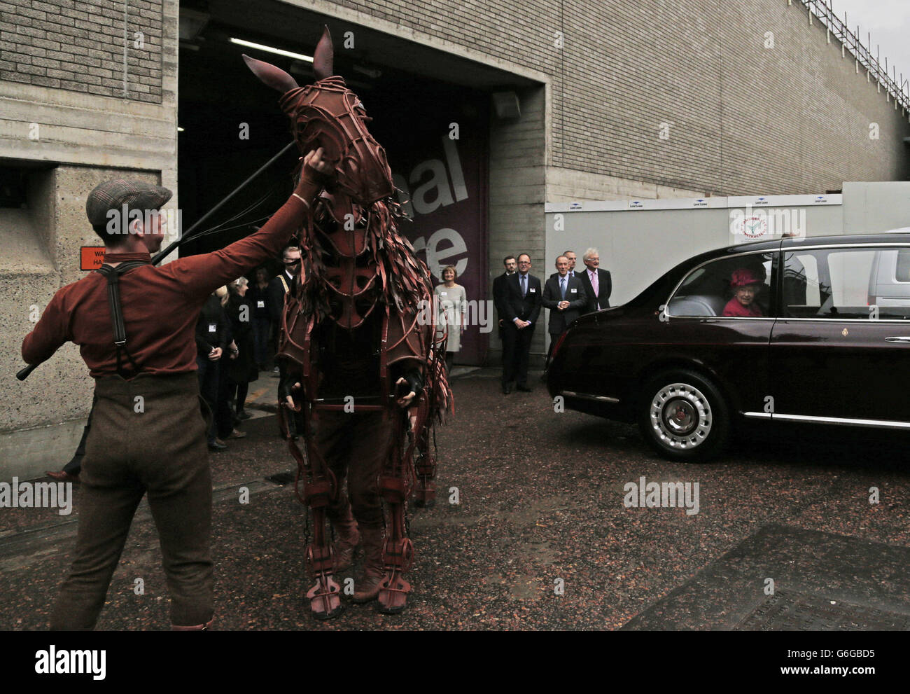 Queen Elizabeth II leaves in a car as actors salute using the horse ...