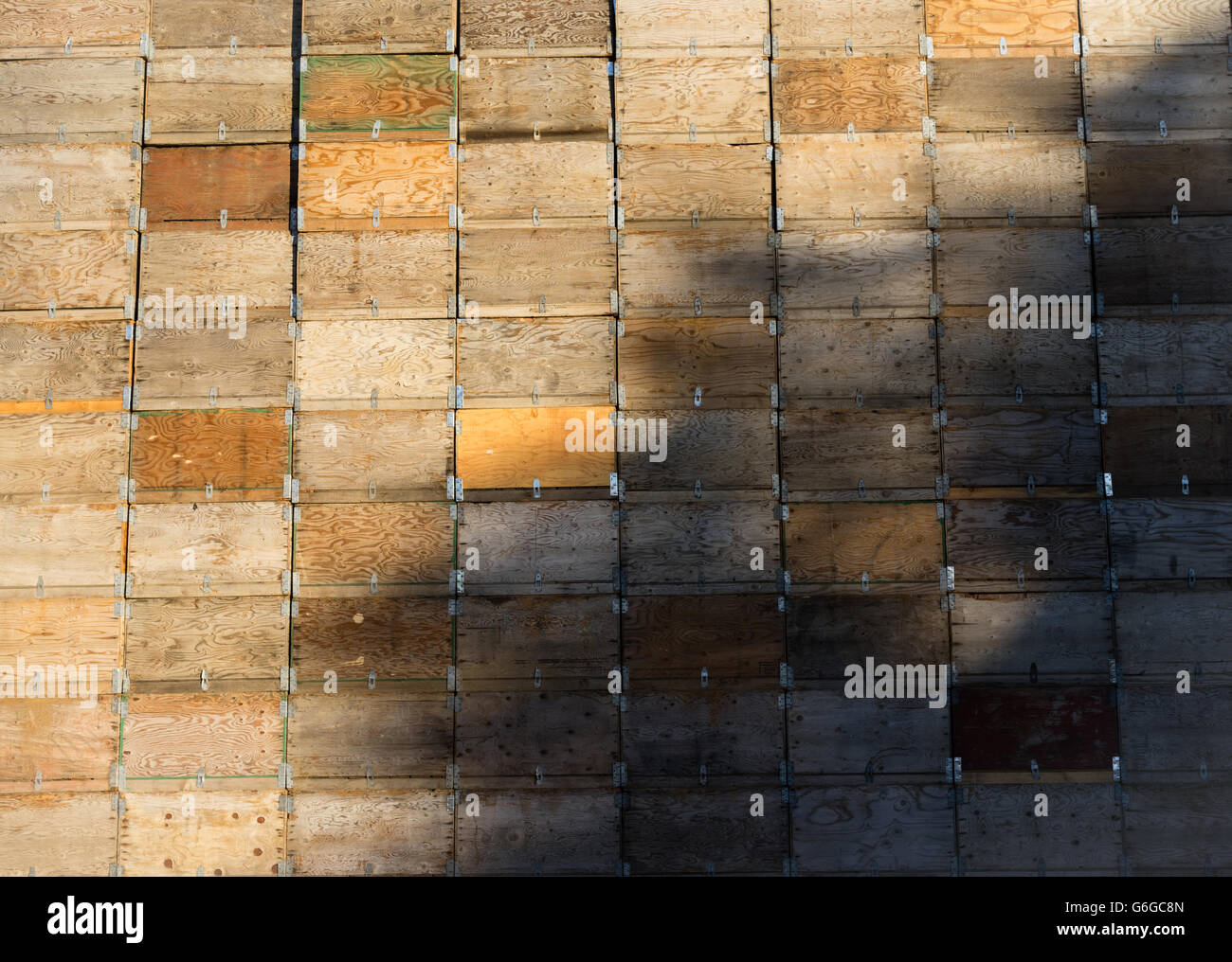 Fruit storage crates boxes are stacked unused before the farm harvest ...