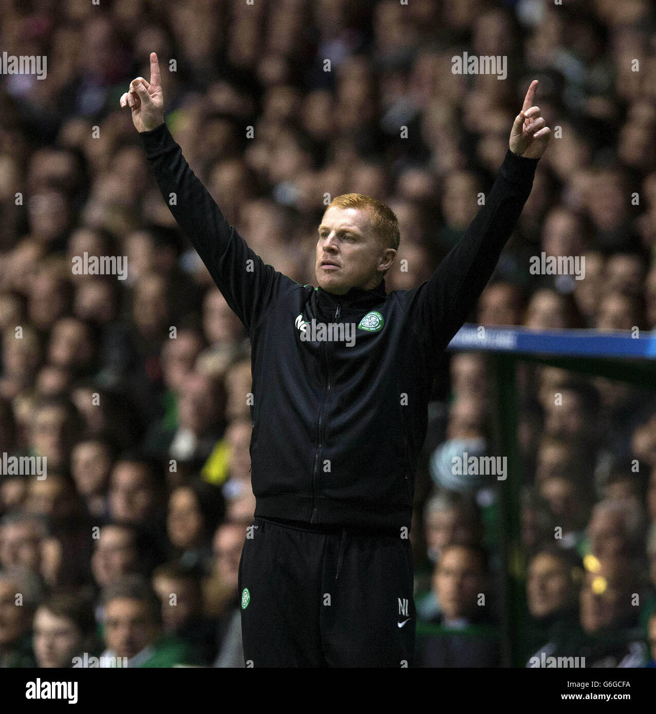Celtic manager Neil Lennon salutes the fans after his team take the ...