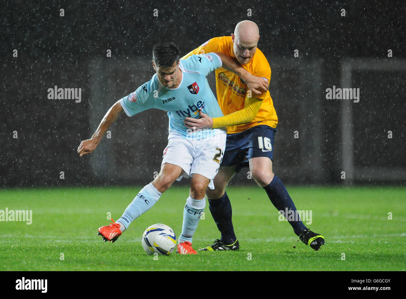 Oxford United's Andrew Whing (right) and Exeter City's Jimmy Keohane ...