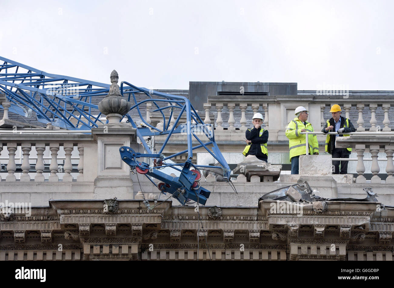 Workmen view damage crane collapsed on roof cabinet office hi-res stock ...