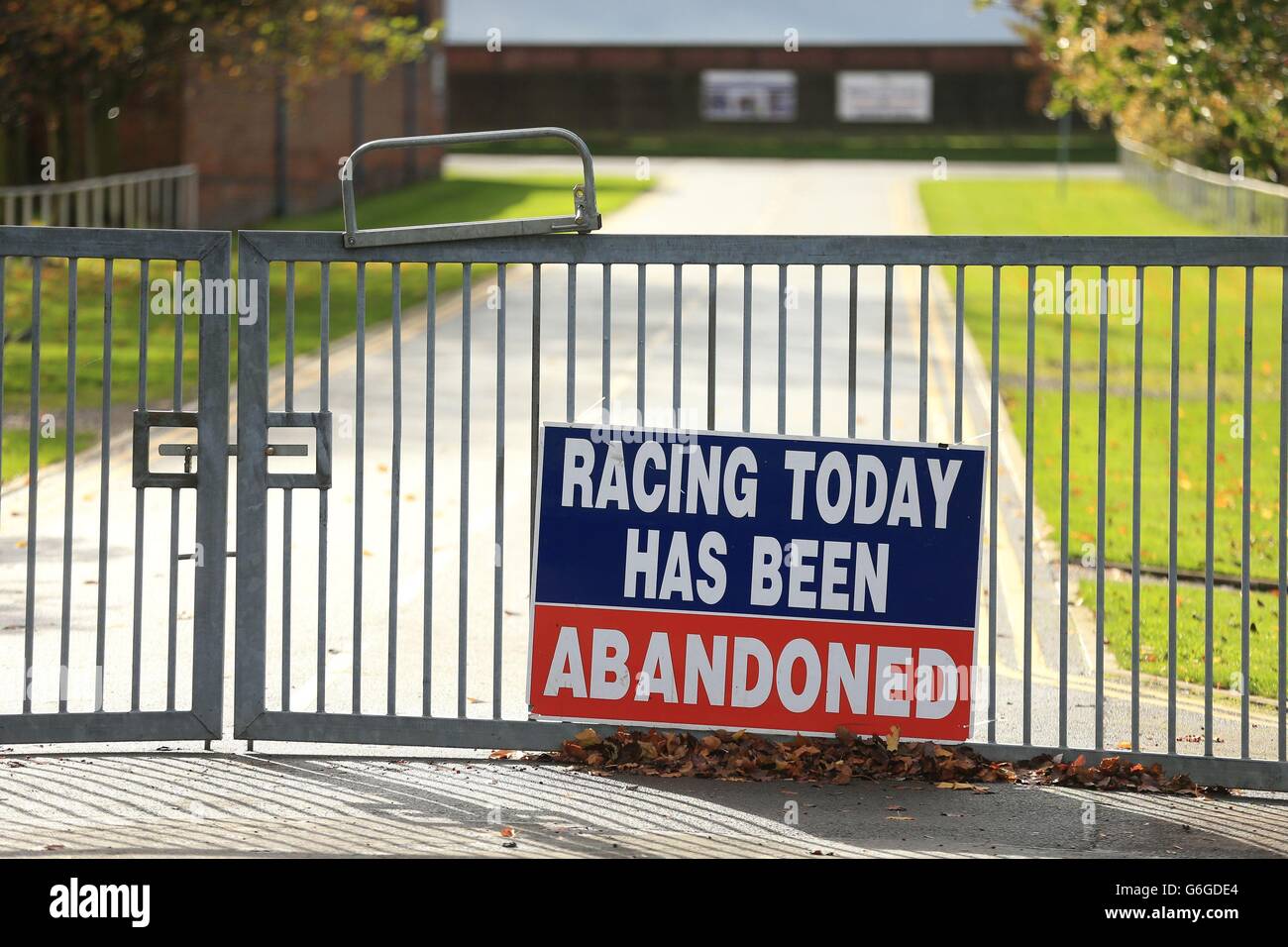 A sign announcing that racing has been abandoned due to a waterlogged ...