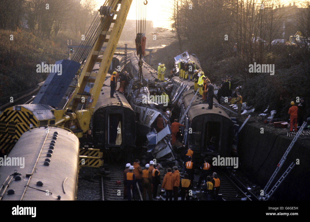 A crane is used to lift the tangled wreckage of a carriage following a ...