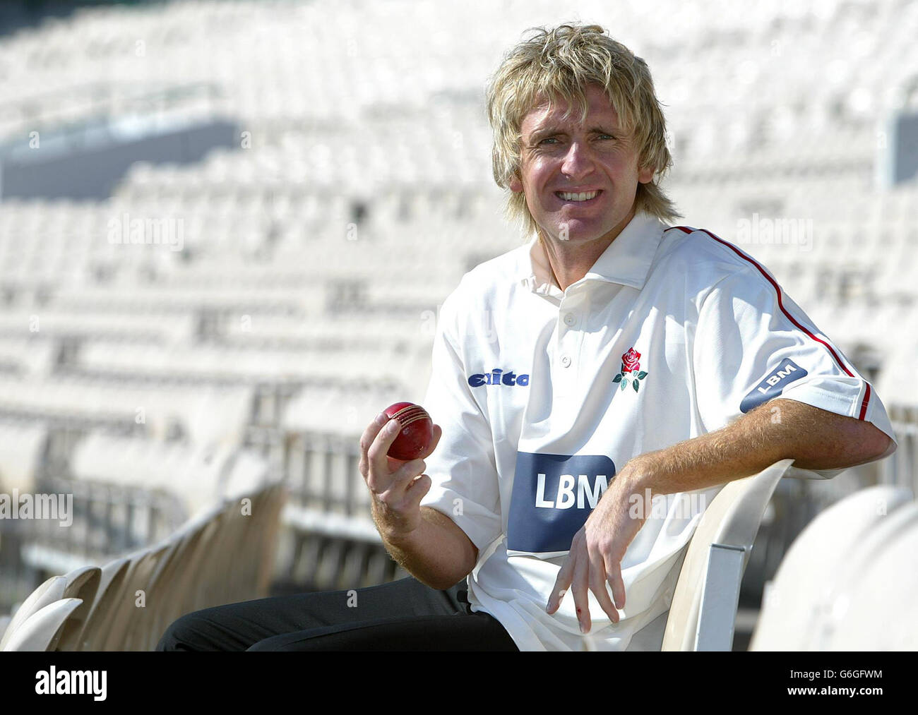 Dominic Cork poses for photographers at the Old Trafford cricket ground ...