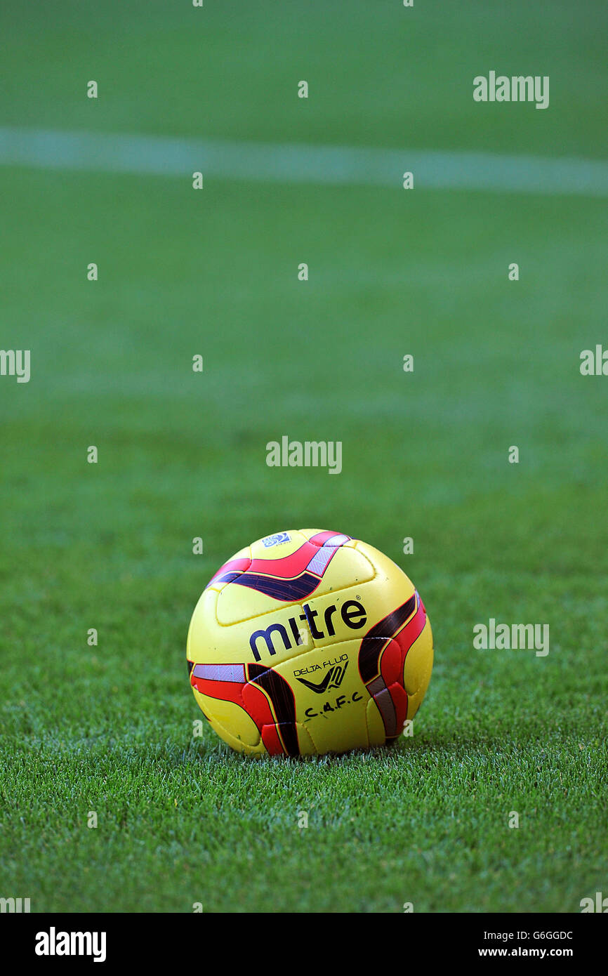 Yellow mitre footballs lie on pitch hi-res stock photography and images ...