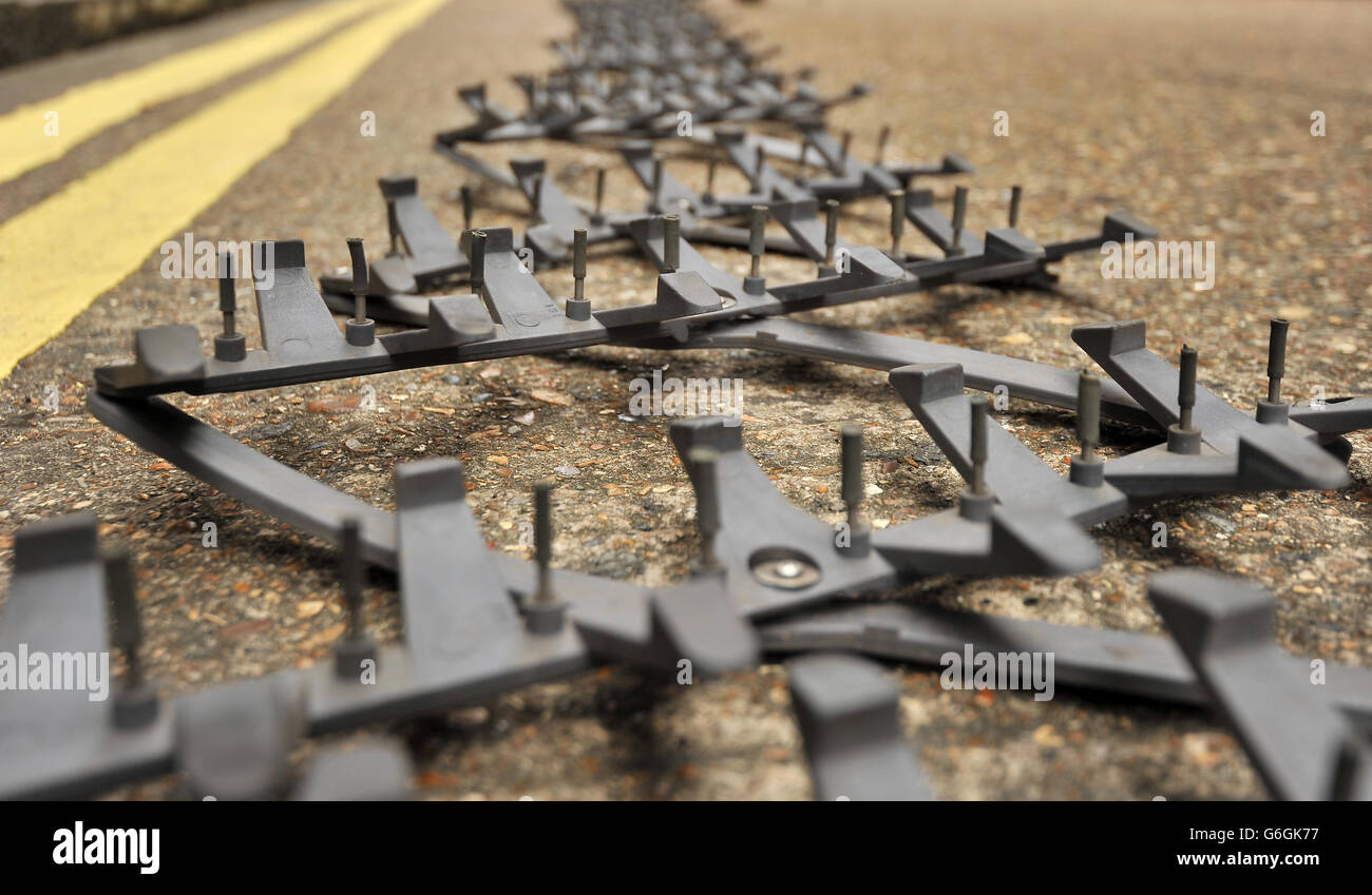 General view of a Police Stinger Spike Strip deployed on a road next to ...