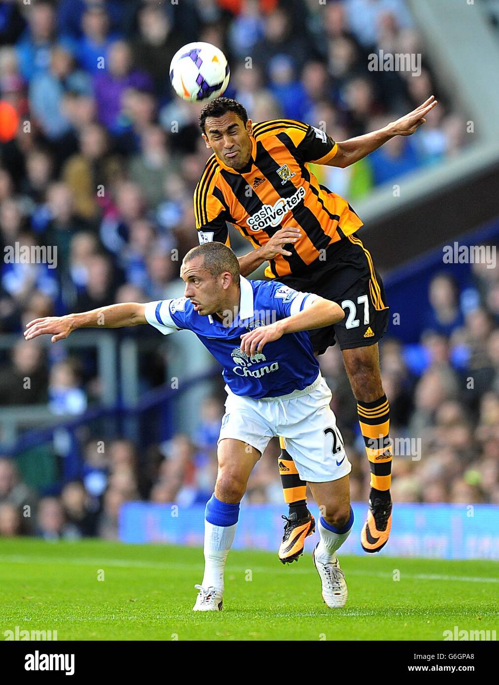 Everton's Leon Osman (left) and Hull City's Ahmed Elmohamady battle for ...