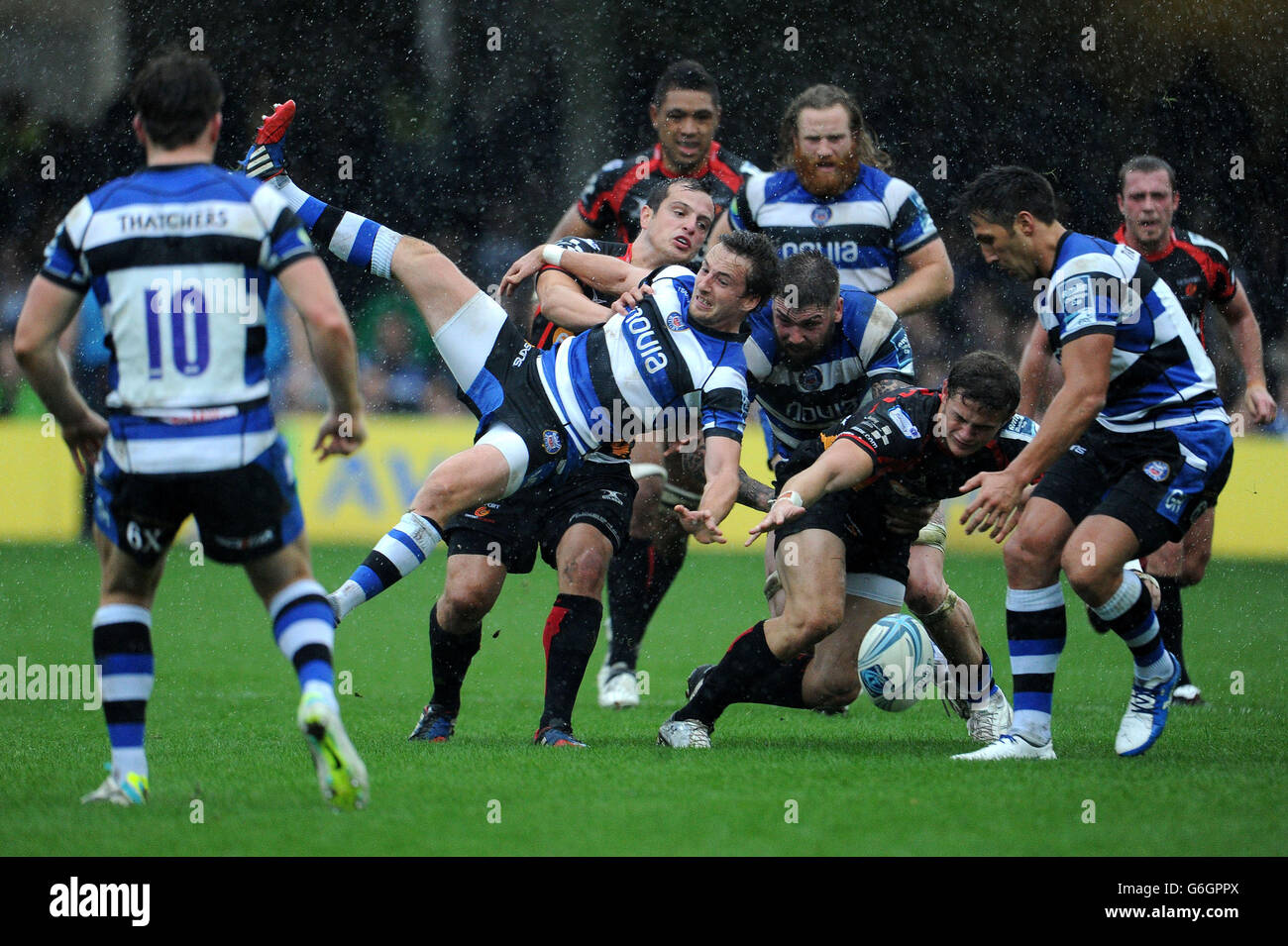 Bath's Martin Roberts is tackled during the Amlin Challenge Cup match ...