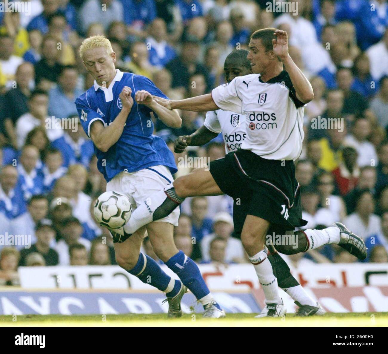 Birmingham City's Mikael Forssell challenges Fulham's Lee Clark (L ...
