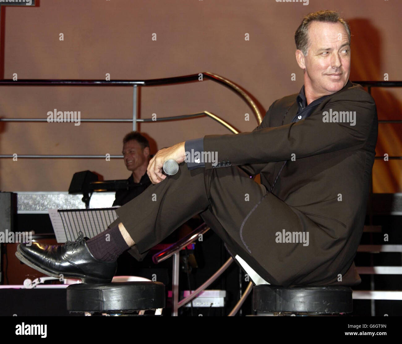 Entertainer Michael Barrymore performs on stage during a photocall for ...