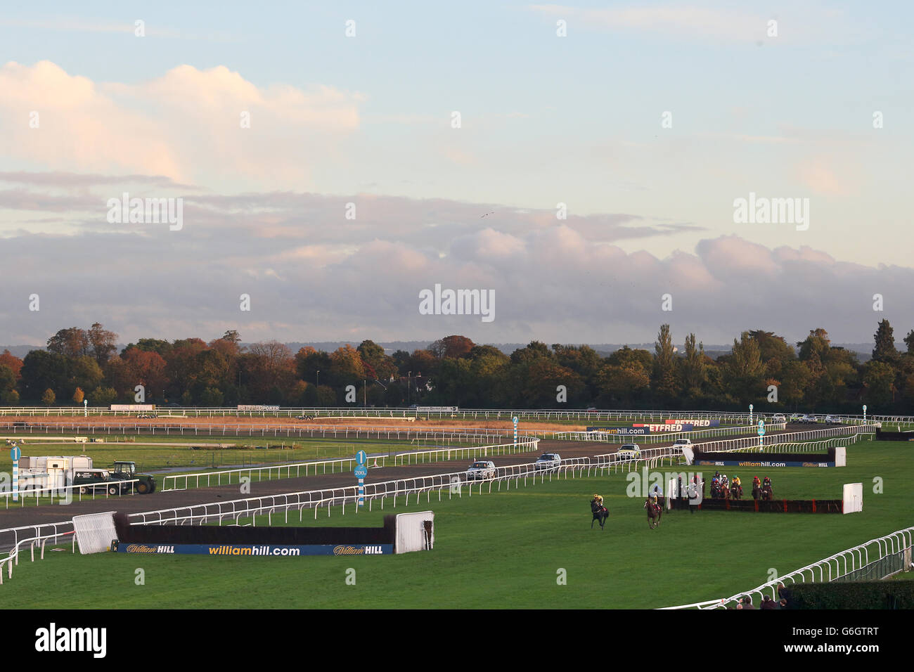 Runners and riders in action at kempton park racecourse hi-res stock ...