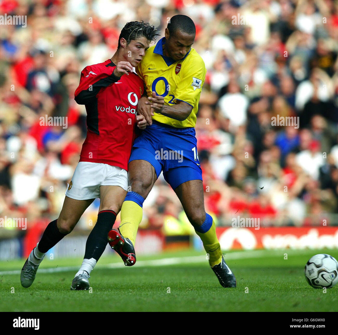 Manchester United's Cristiano Ronaldo (left) goes shoulder to shoulder ...