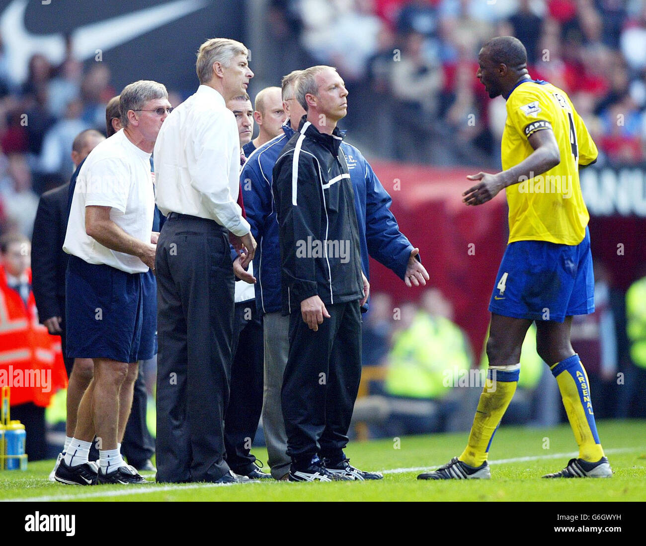 Arsenal's Patrick Vieira (right) walks off the pitch pleading to the ...
