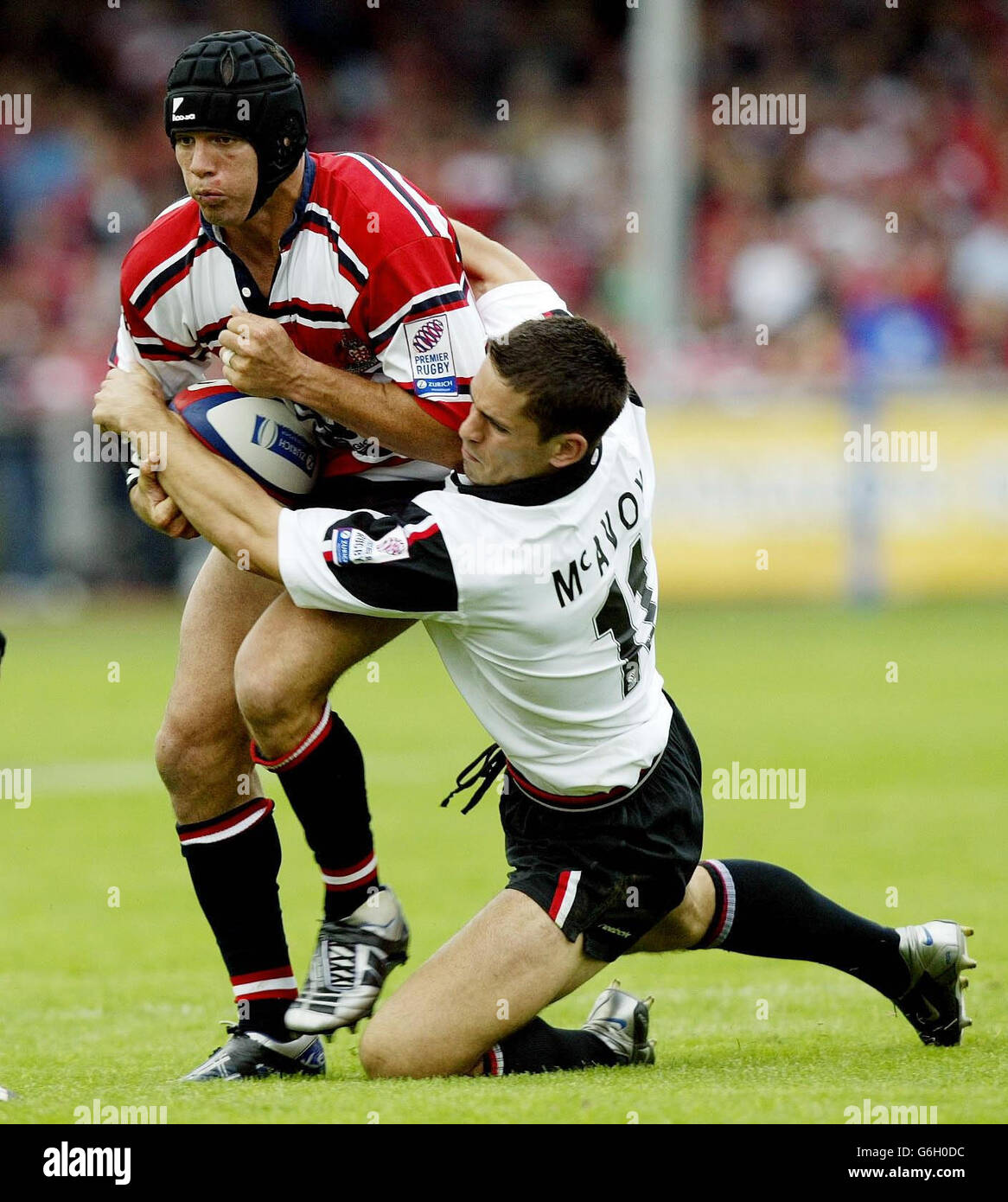 Gloucester's Henry Paul is tackled by Saracens Nathan McAvoy during ...