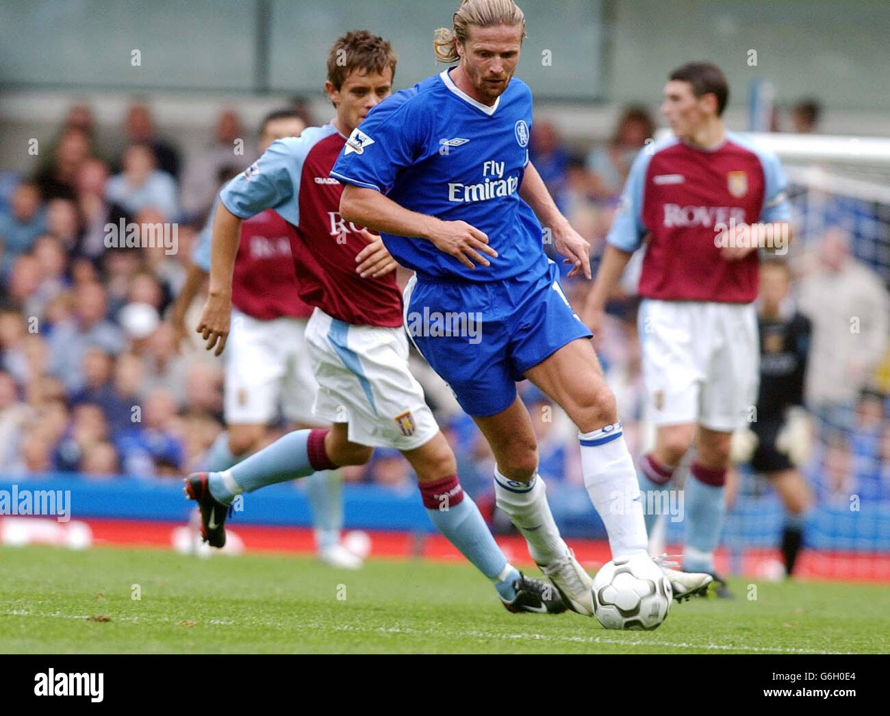 Left to right, Villa's Lee Hendrie and Chelsea's Emmanuel Petit during ...