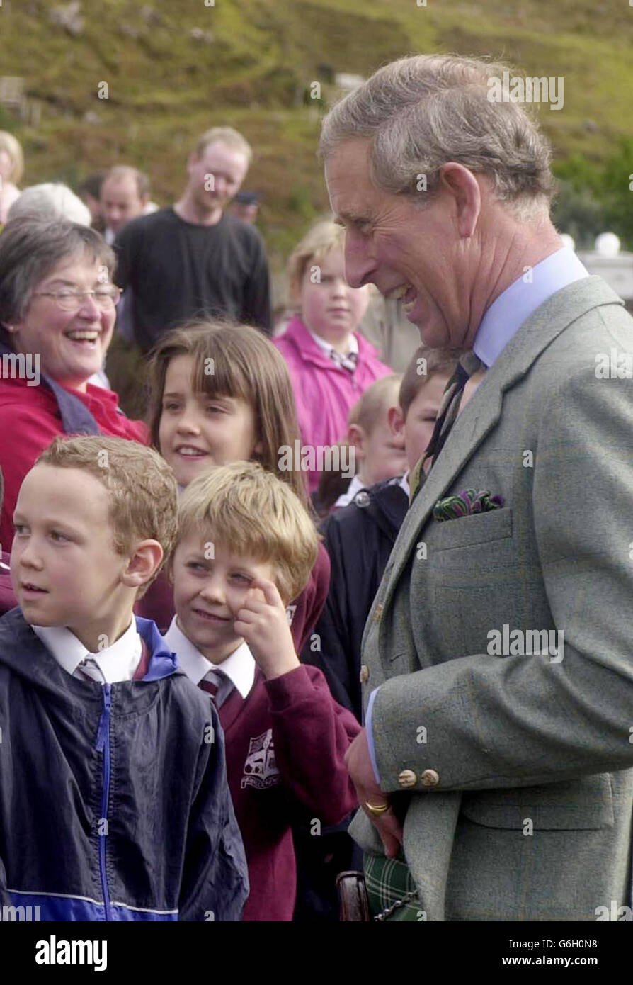 The Prince of Wales talks to local schoolchildren during a visit to ...