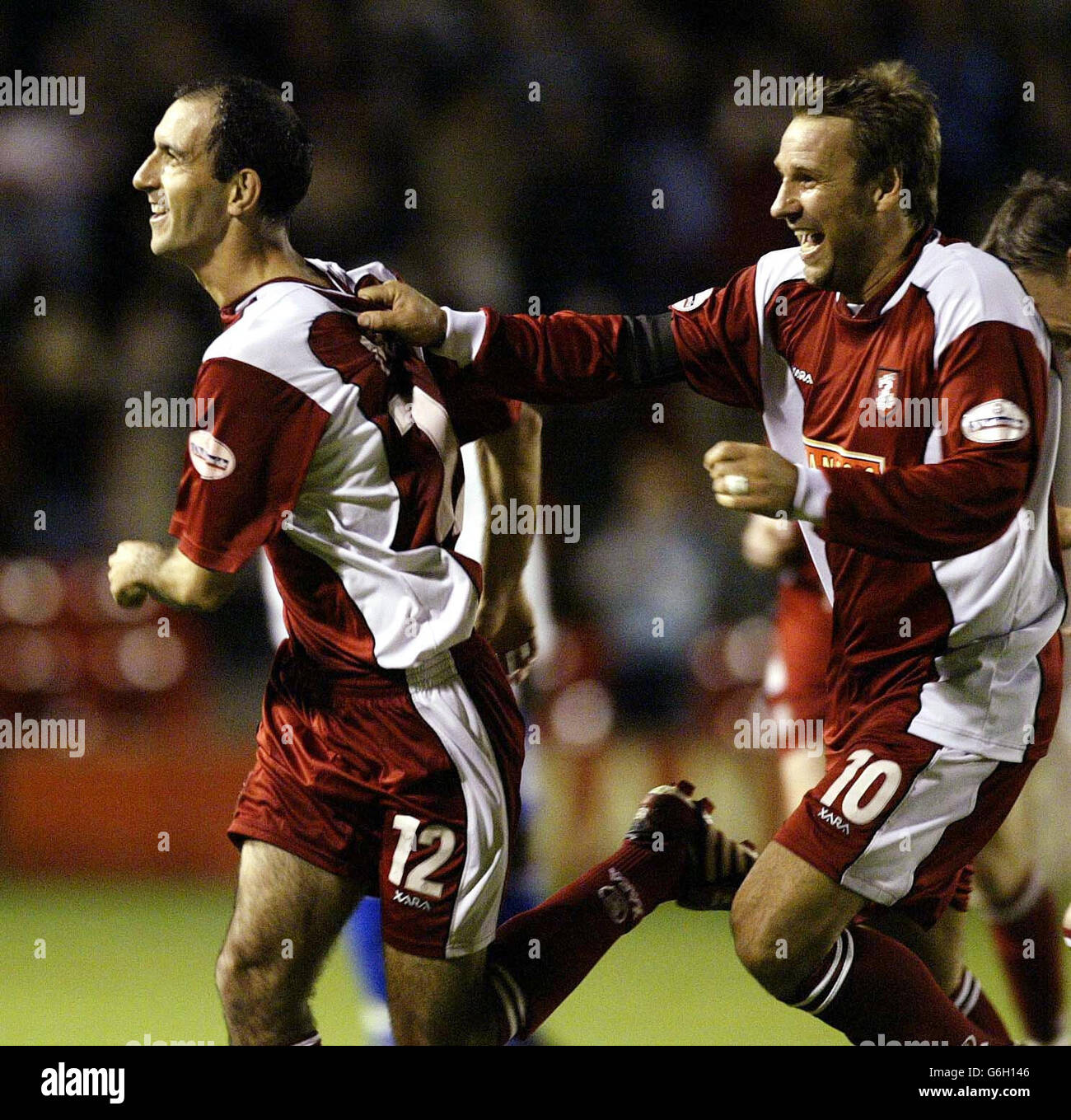 Walsall's Pedro Matias (left) celebrates scoring the opening against ...