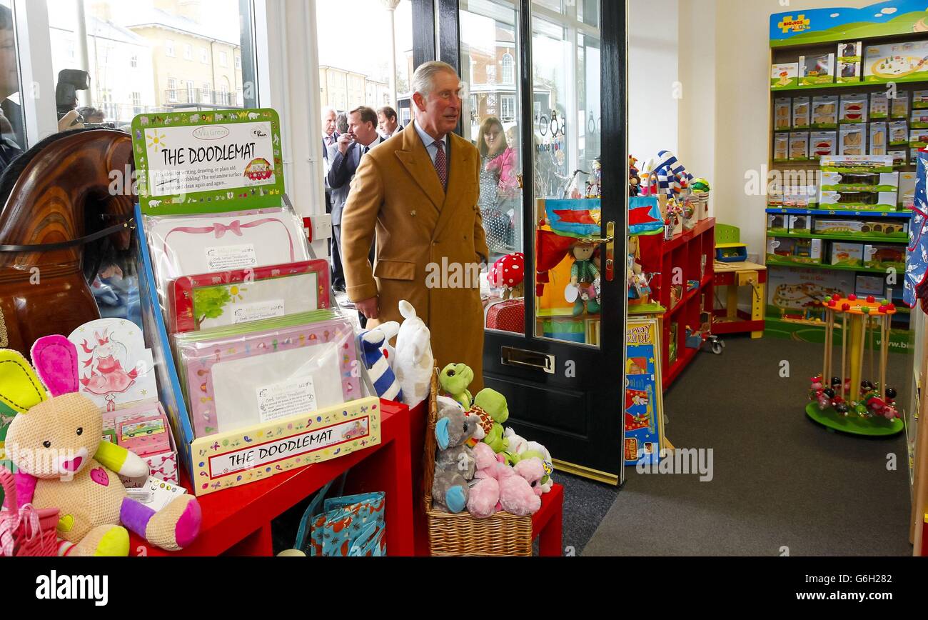 The Prince of Wales looks around a toy shop in his Poundbury ...