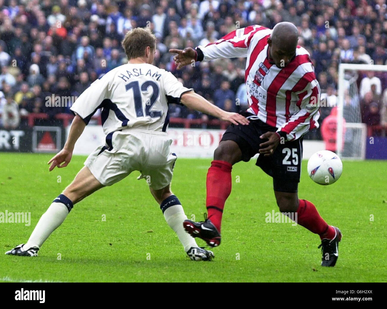 Brentford's Tony Rougier and Sheffield Wednesday's Steven Haslam (L ...