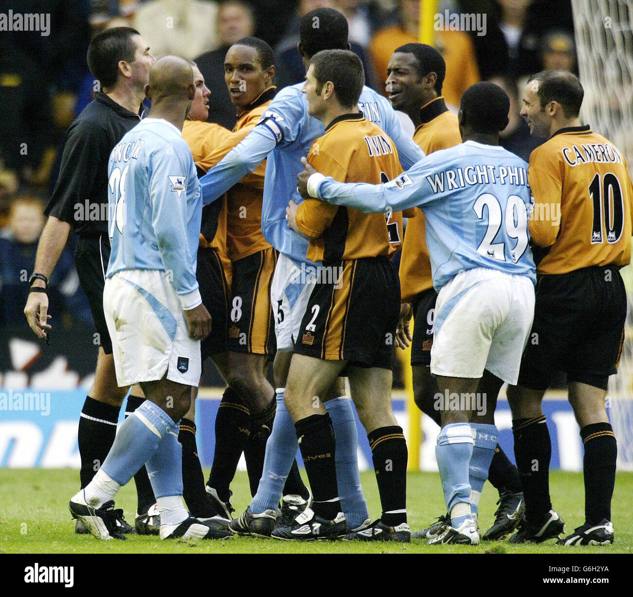 Wolverhampton Wanderers' Paul Ince (fourth left) is held away from ...