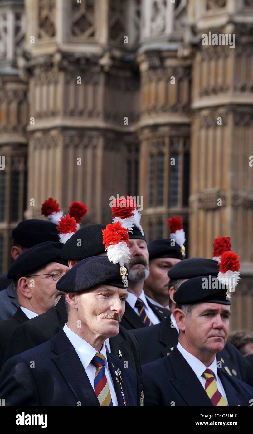 Former Fusiliers, stand outside Parliament in Westminster during a ...