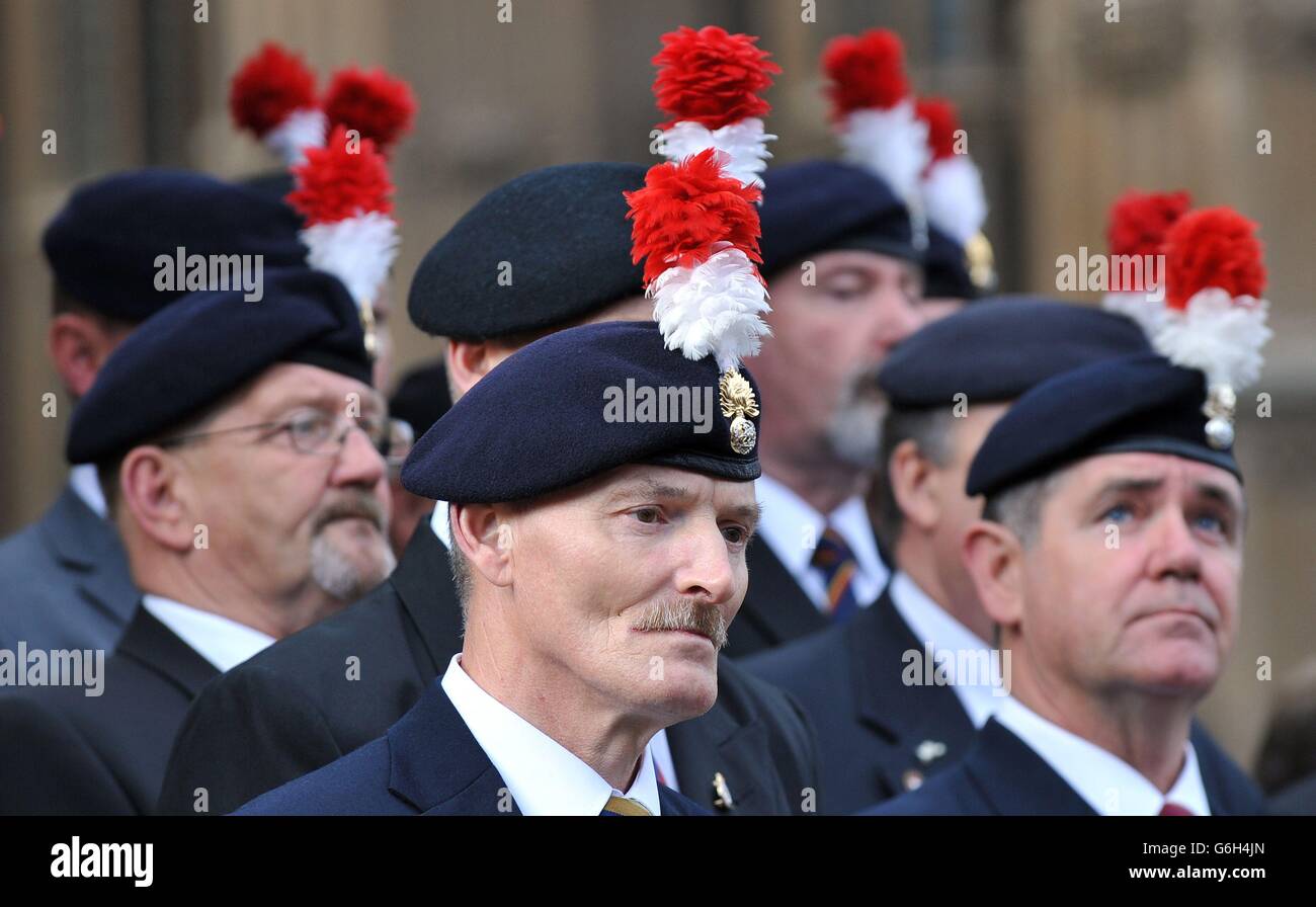 Former Fusiliers, stand outside Parliament in Westminster during a ...