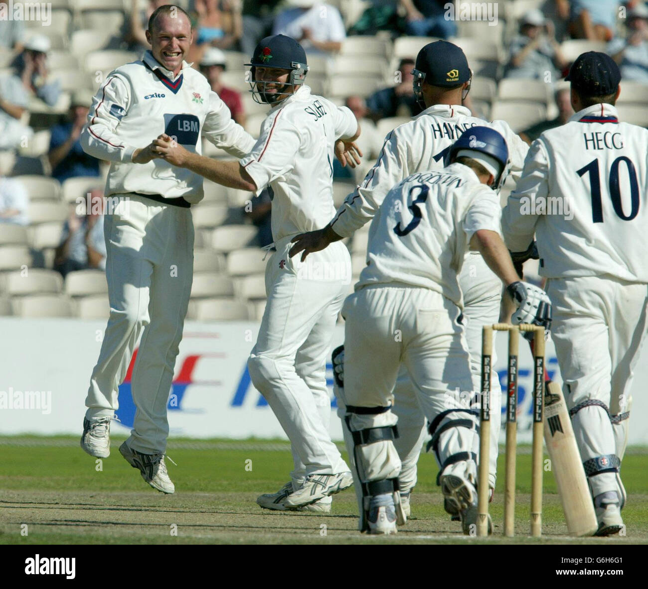 Lancashire players rush to congratulate Gary Keedy (far left) after he ...