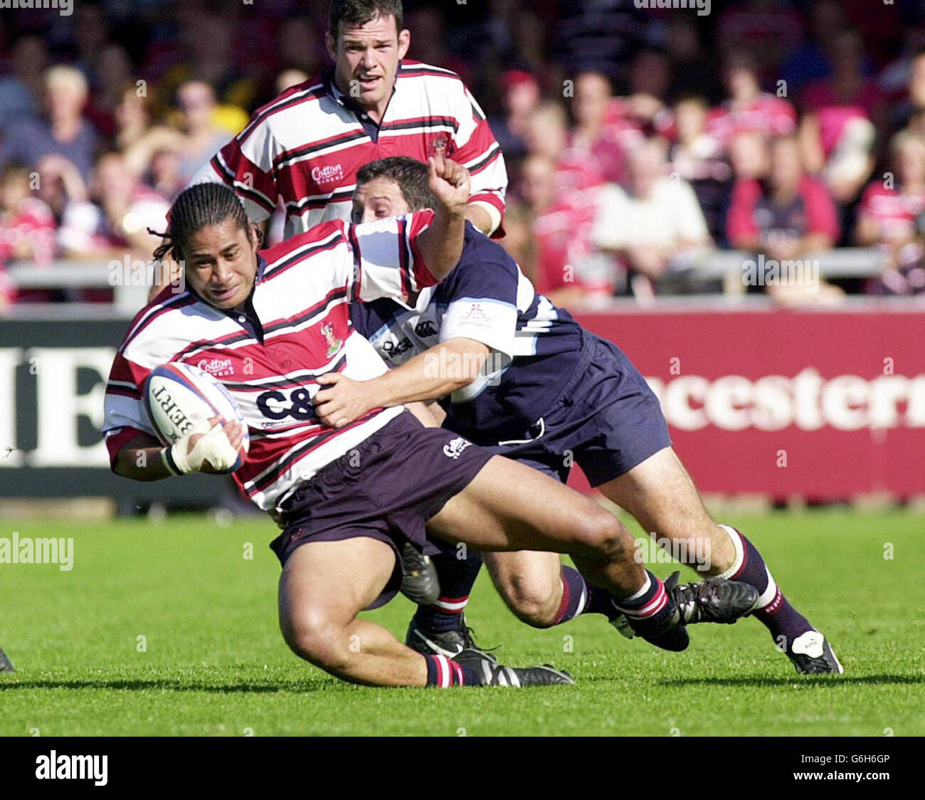 Gloucester'sTerry Fanolua (front) is tackled by Rotherham's Jason ...