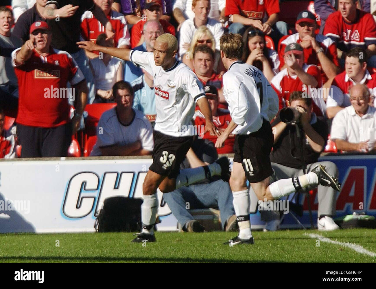 Derby striker Junior (number 33) celebrates the winning goal in front ...