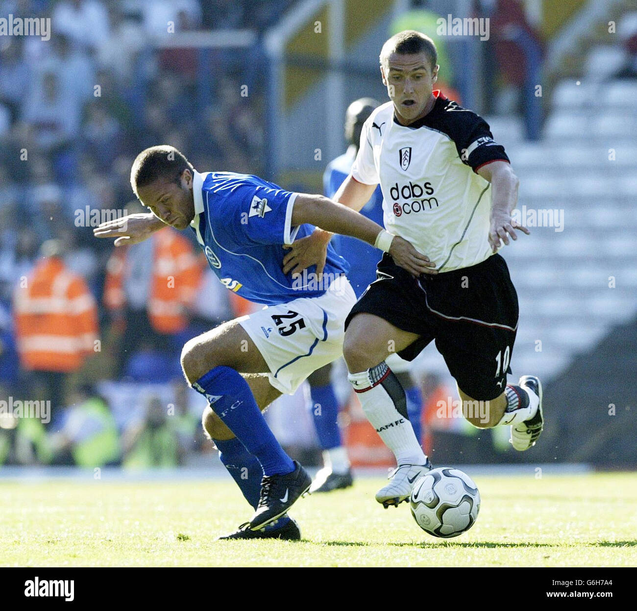 Fulham's Lee Clark skips past Birmingham City defender Matthew Upson ...