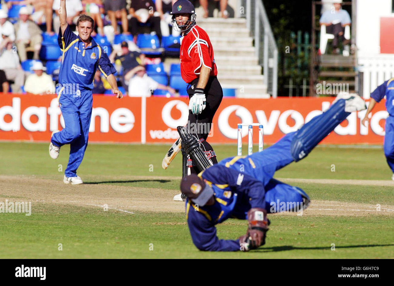 Surrey wicketkeeper Jonathan Batty catches Glamorgan's David Hemp ...