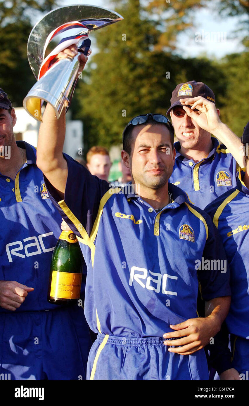Surrey captain Adam Hollioake holds up the National Cricket League ...