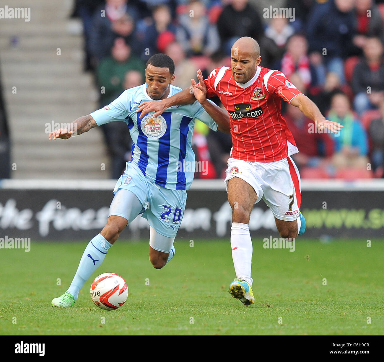 Coventry City's Callum Wilson (left) and Walsall's Adam Chambers battle ...
