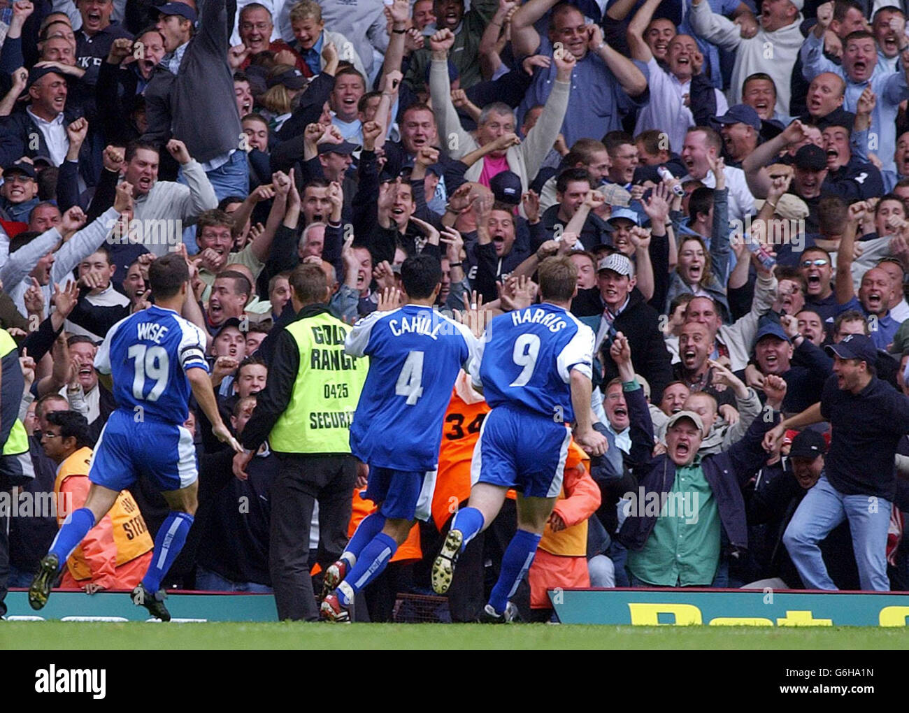 From left, Millwall's Dennis Wise, Tim Cahill and Neil Harris celebrate ...