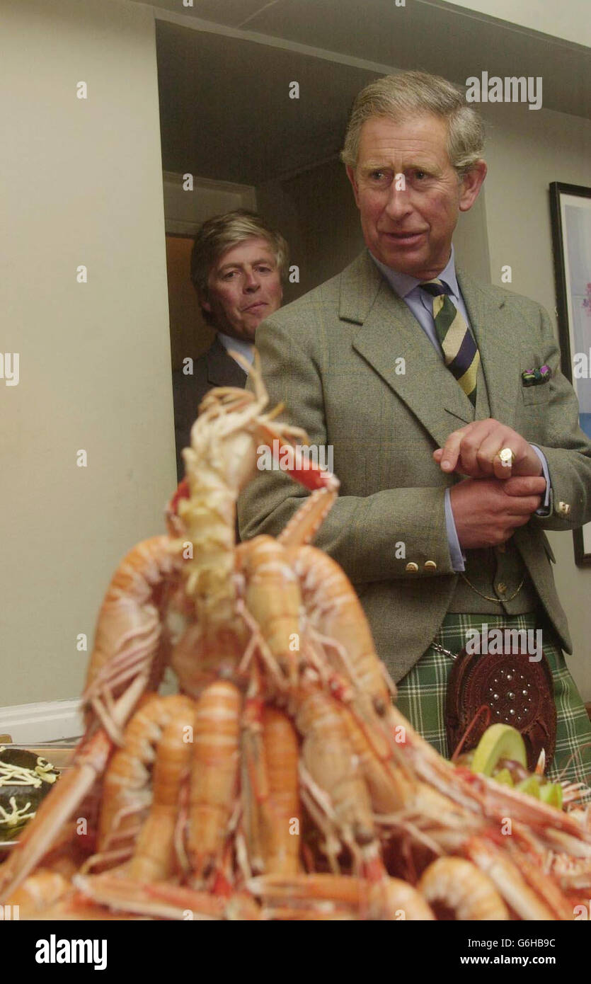 The Prince of Wales is shown a plateful of freshly caught prawns from ...